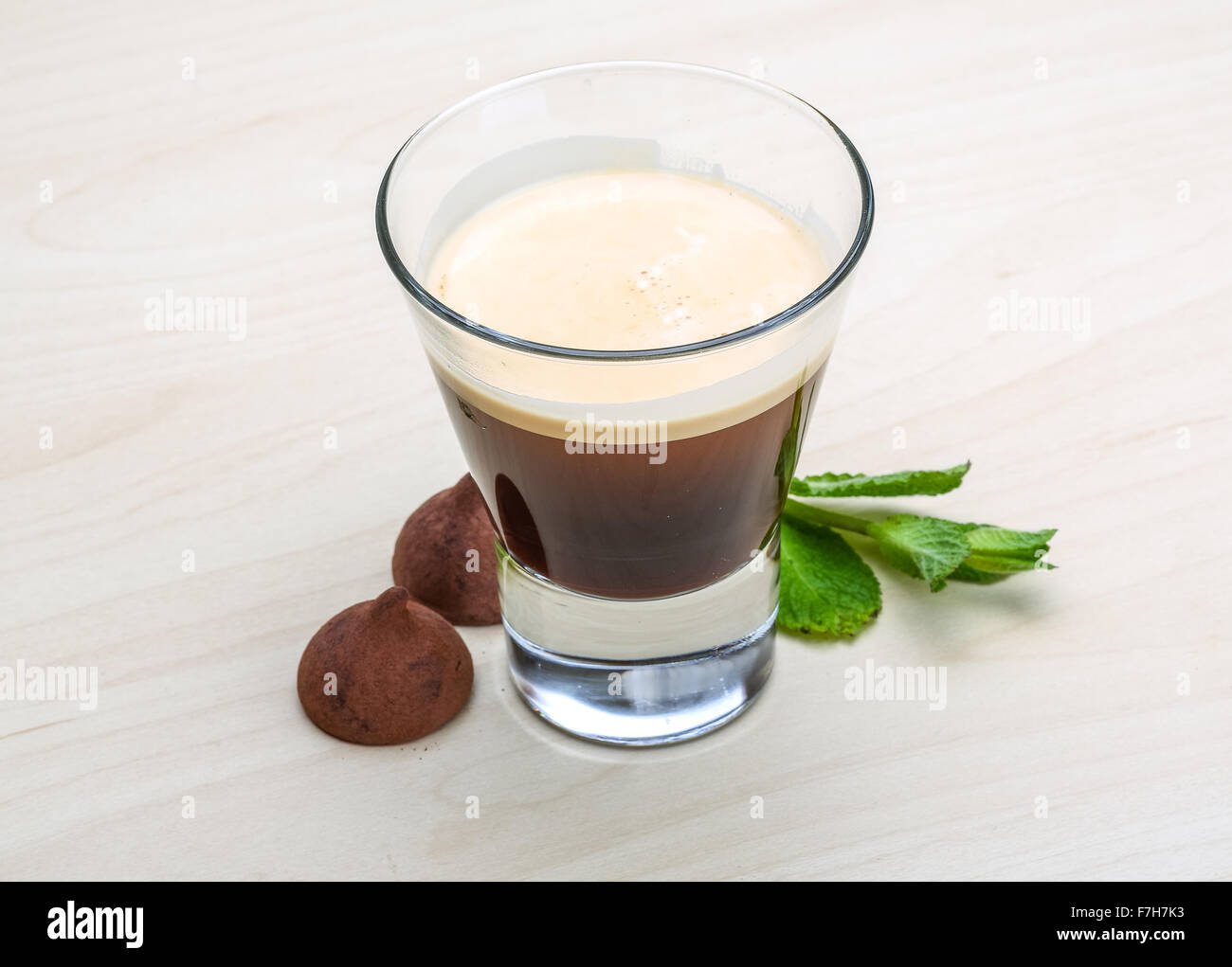Espresso with chocolate candy with fresh mint leaves Stock Photo - Alamy