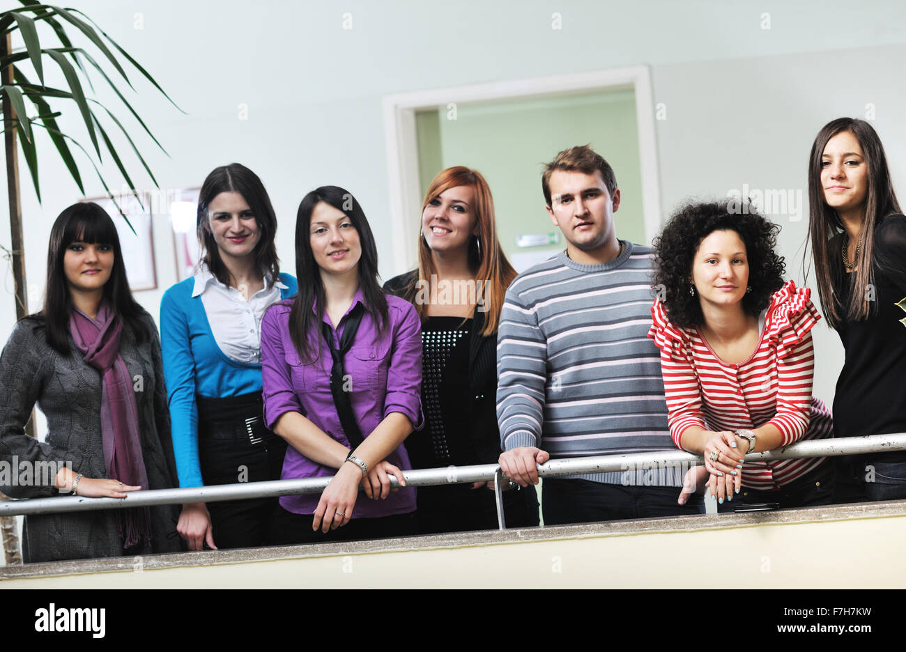 happy students people group portrait at university indoor building ...