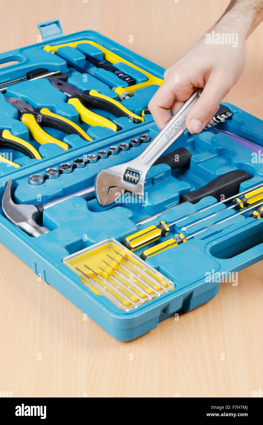 Repairman with his toolkit Stock Photo - Alamy