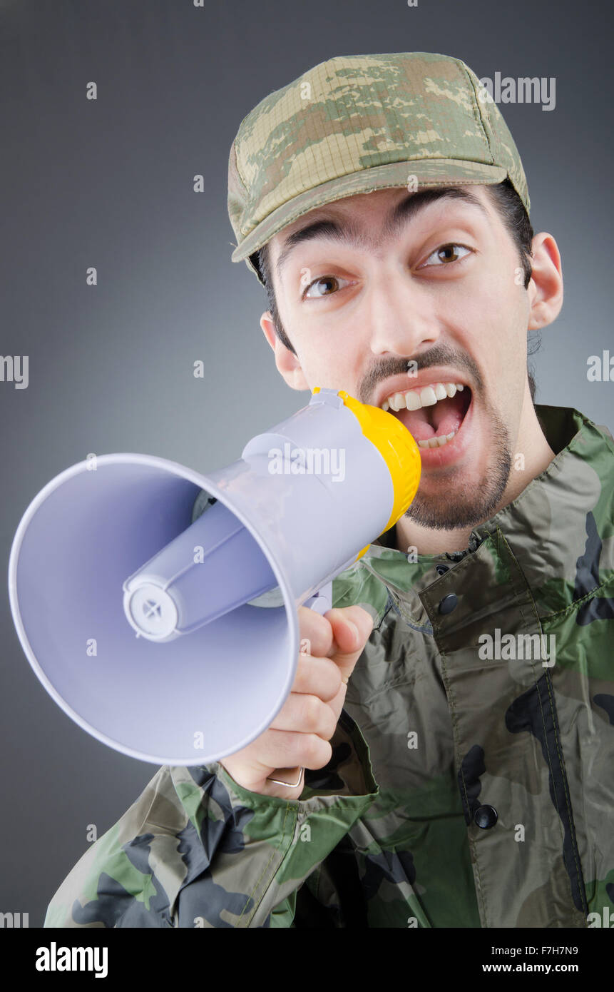 Soldier with loudspeaker shouting Stock Photo - Alamy