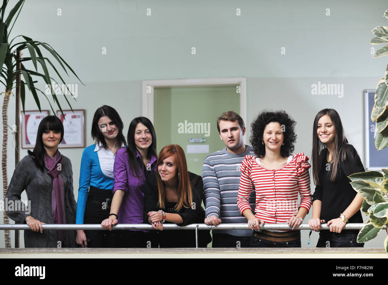 happy students people group portrait at university indoor building ...