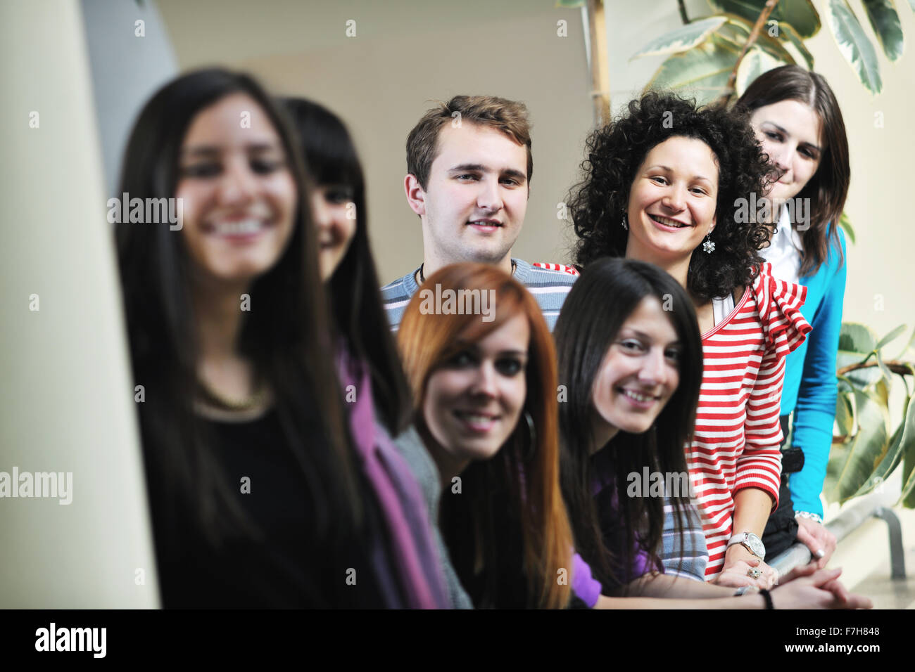 happy students people group portrait at university indoor building ...