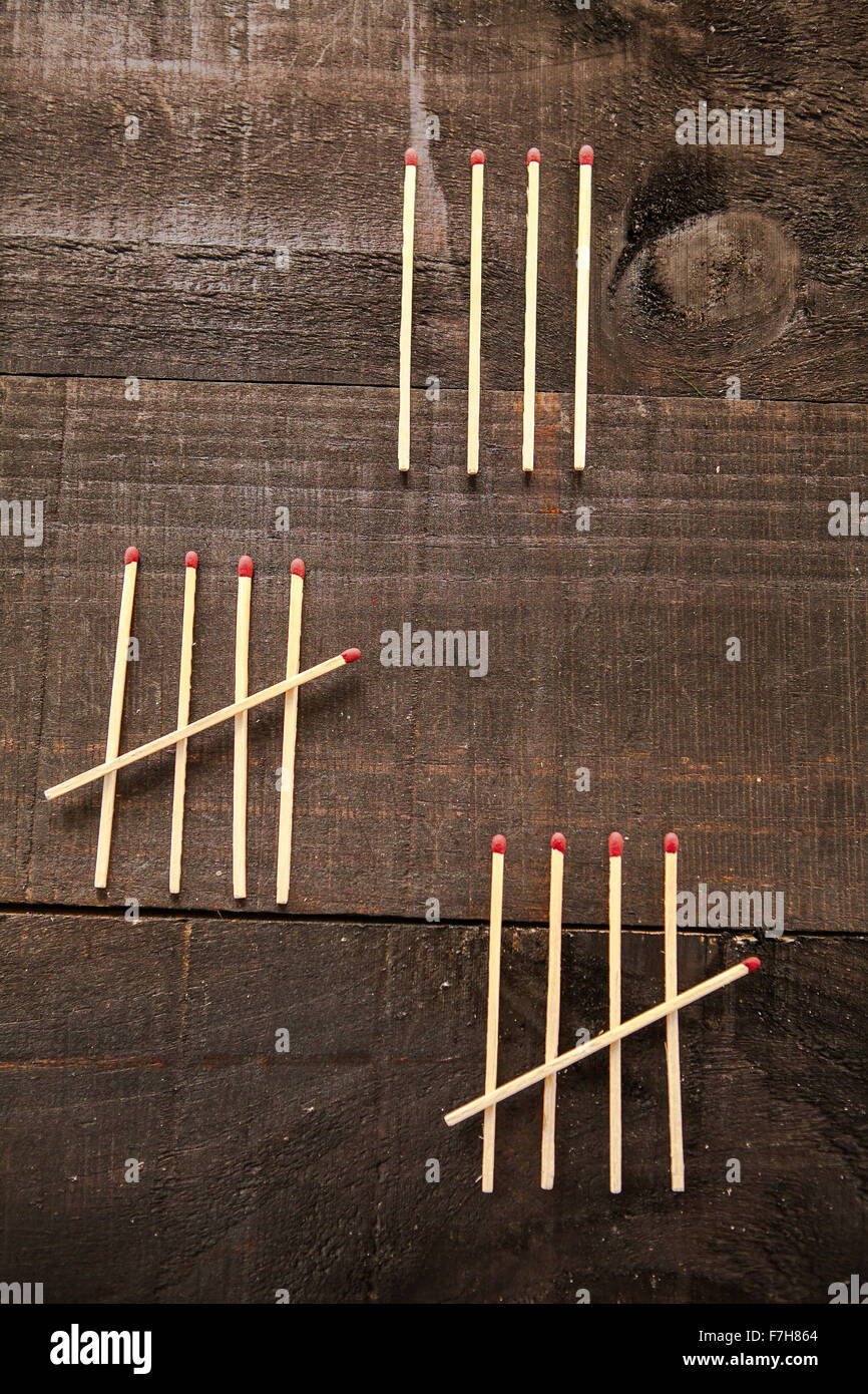 Group of matches on a wood background Stock Photo - Alamy