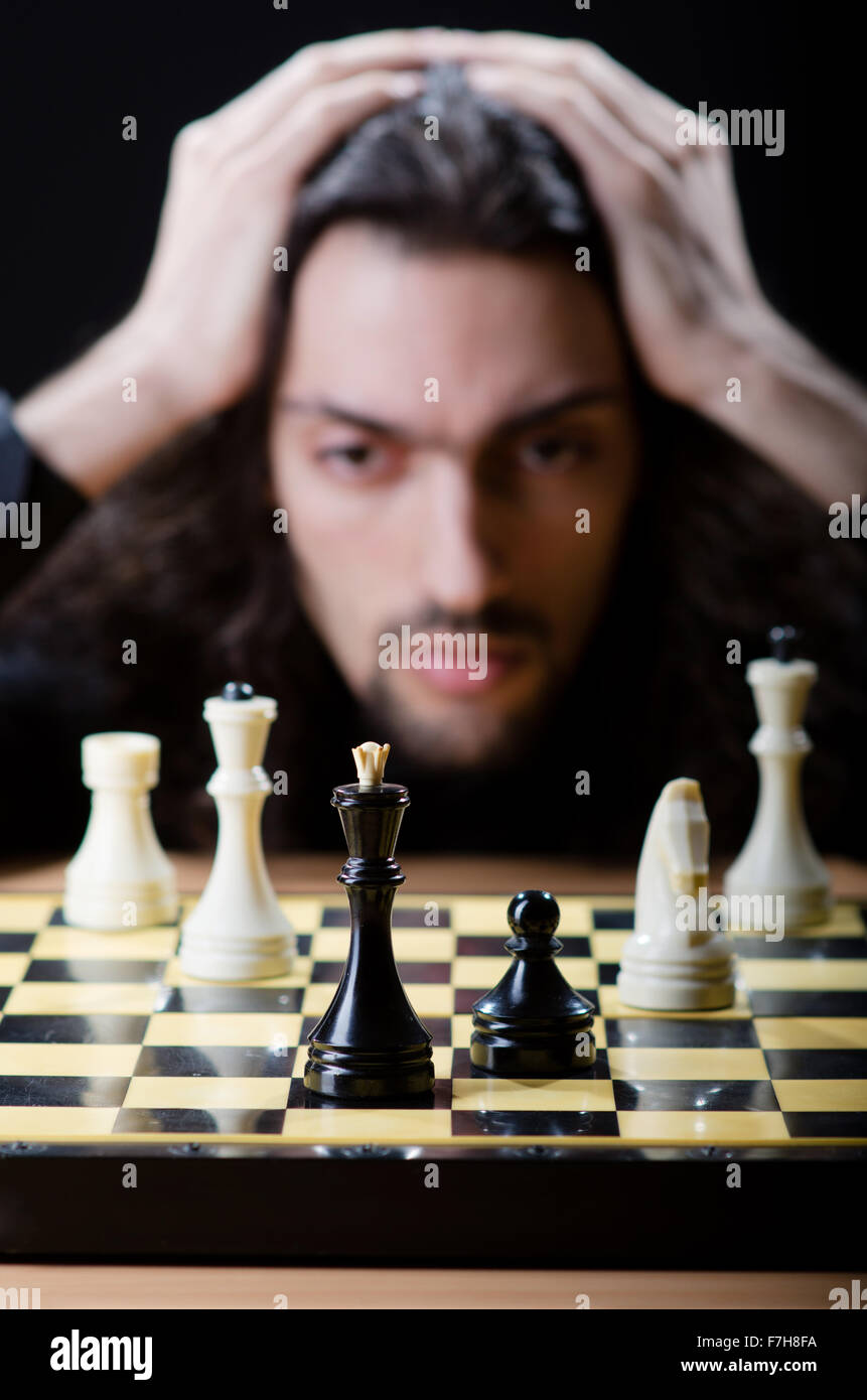 Chess player playing his game Stock Photo - Alamy