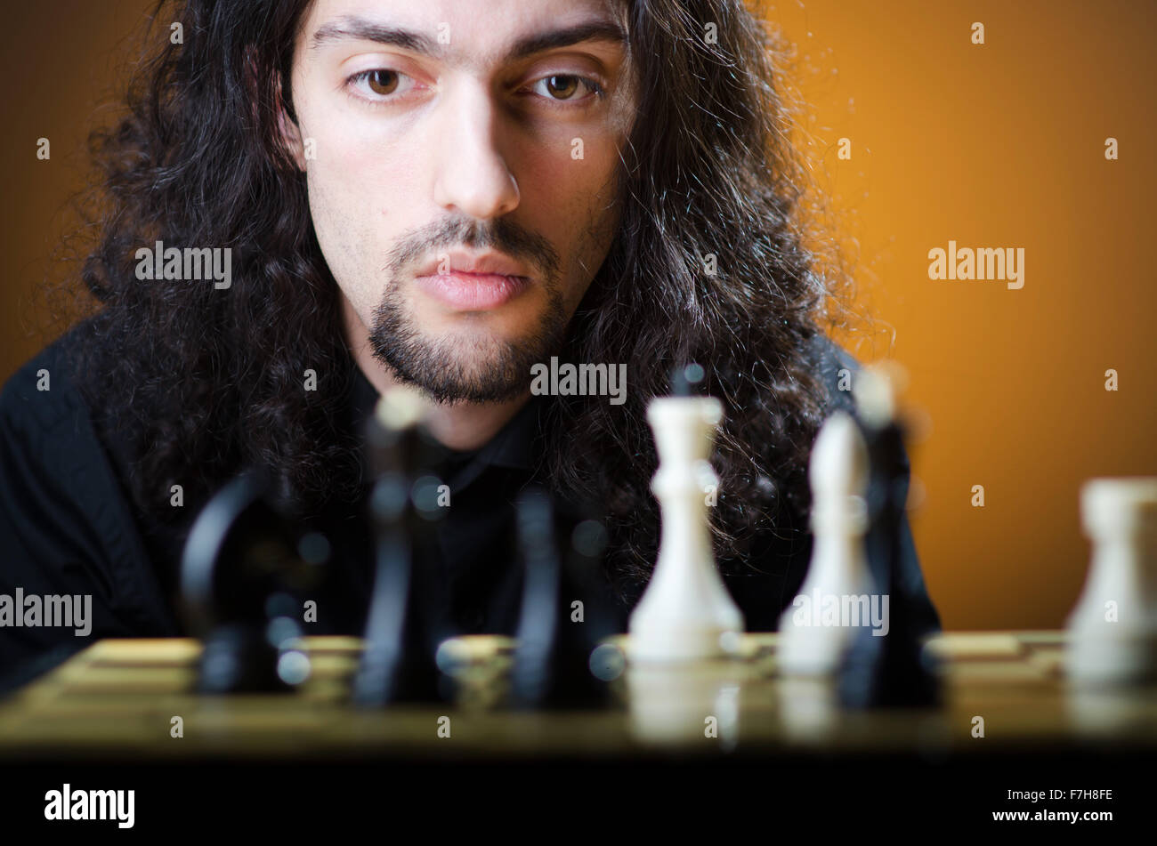 Chess player playing his game Stock Photo - Alamy