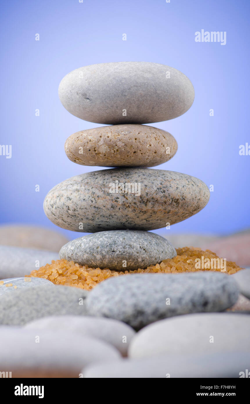 Balanced pebbles with colour background Stock Photo - Alamy