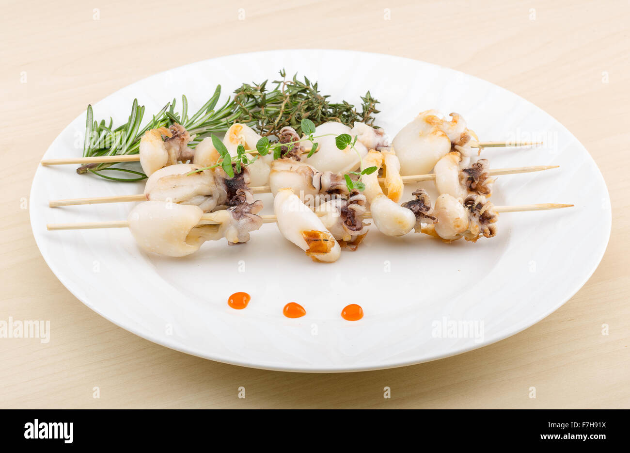 Grilled cuttlefish bbq with rosemary and pepper Stock Photo - Alamy