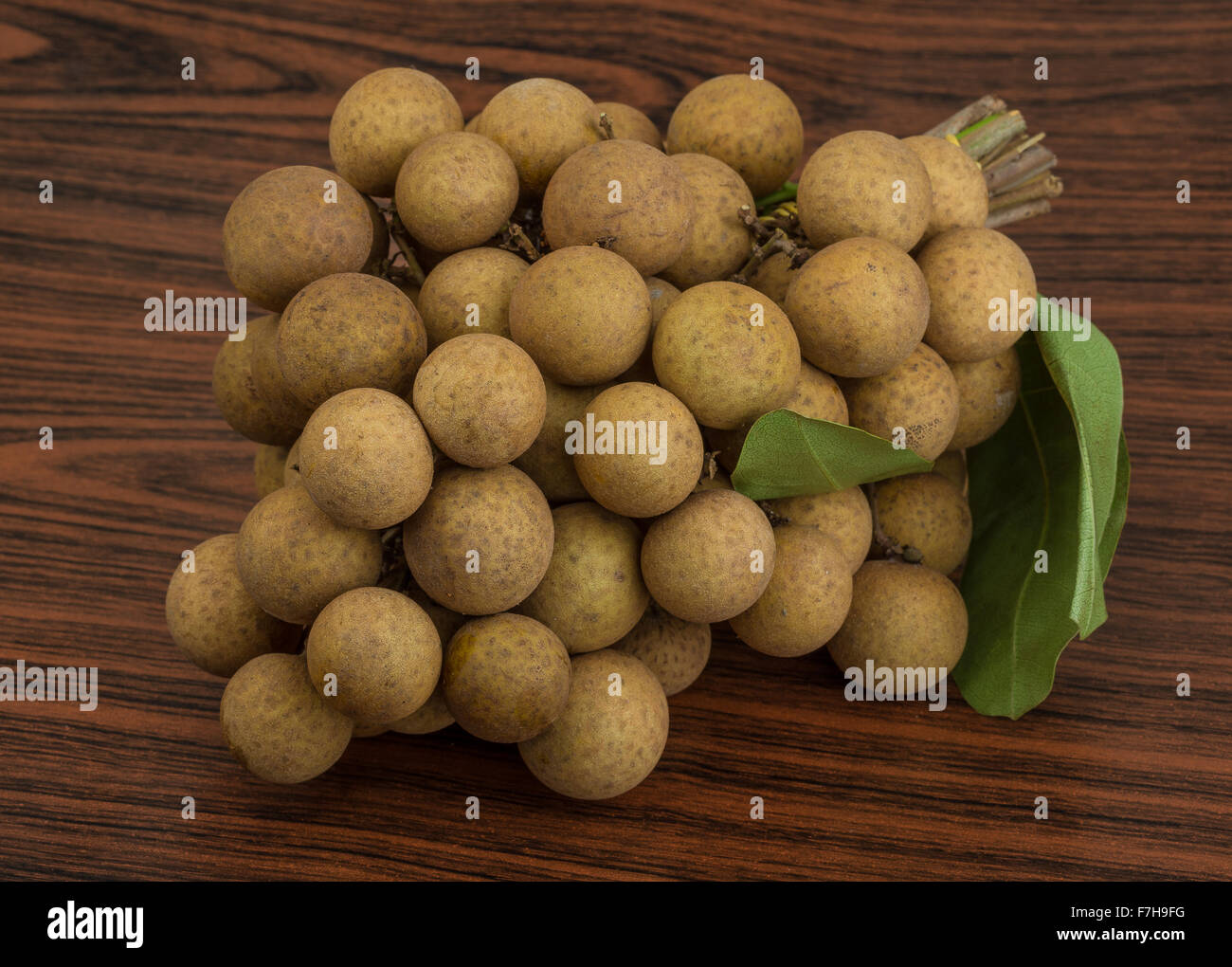 Asian fruit Longan - on wood background Stock Photo - Alamy