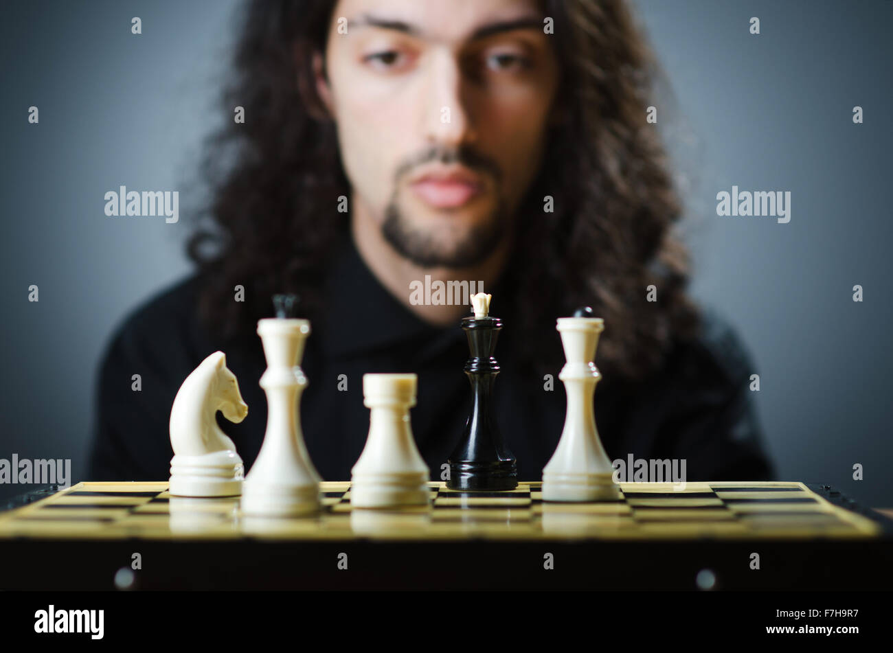 Chess player playing his game Stock Photo - Alamy