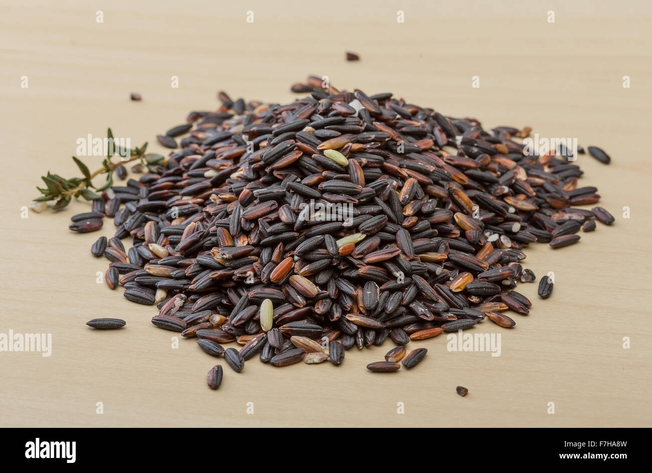 Dry wild rice mix heap on the wood background Stock Photo - Alamy