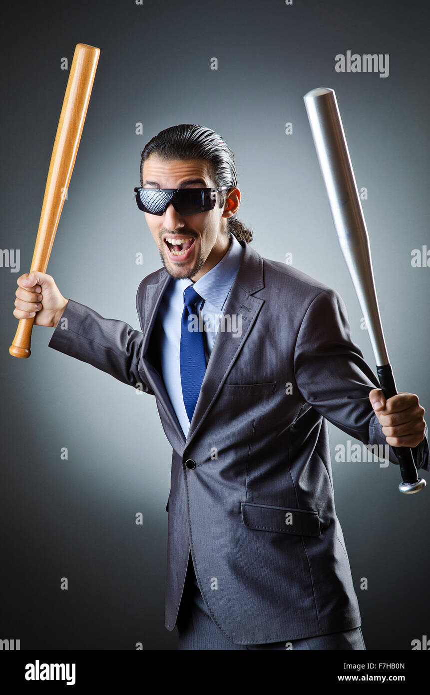 Angry businessman with bat on white Stock Photo - Alamy