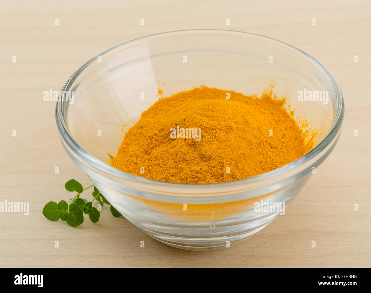 Yellow Tumeric powder in the glass bowl Stock Photo - Alamy