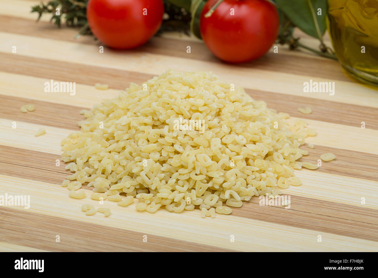 Raw ABC macaroni on the wood background Stock Photo - Alamy