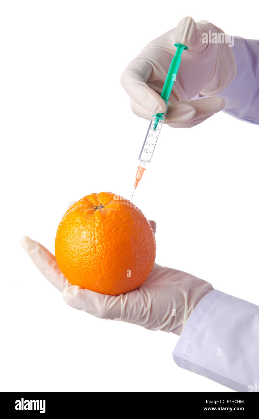 Science experiment with orange and syringe Stock Photo - Alamy
