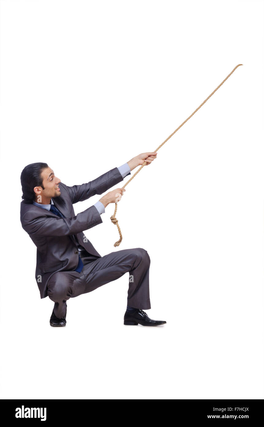 Businessman pulling rope on white Stock Photo - Alamy