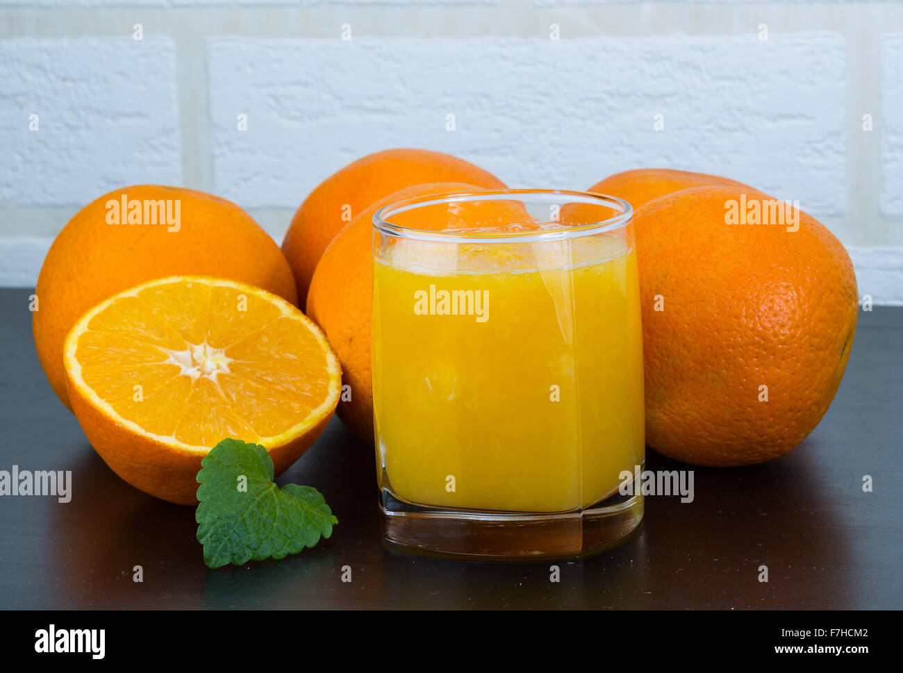 Fresh made Orange juice with ripe fruits Stock Photo - Alamy