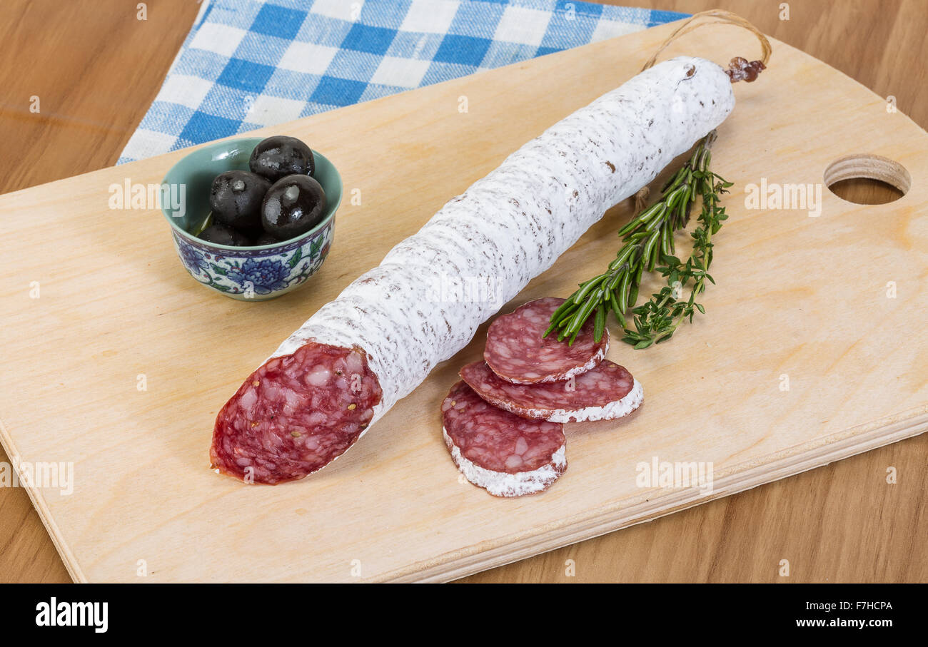 Fuet sausage - Spanish meat sliced with herbs Stock Photo - Alamy