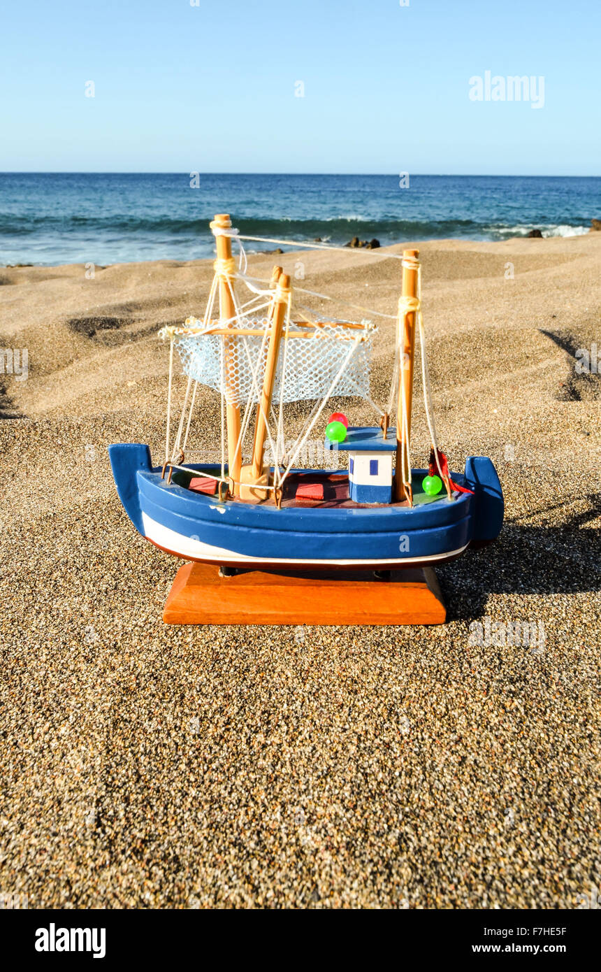 Toy Boat on the Sand Beach Stock Photo - Alamy