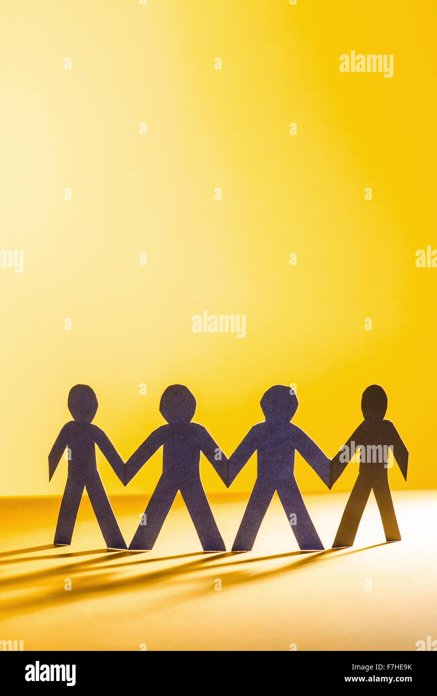 Paper people in teamworking concept Stock Photo - Alamy