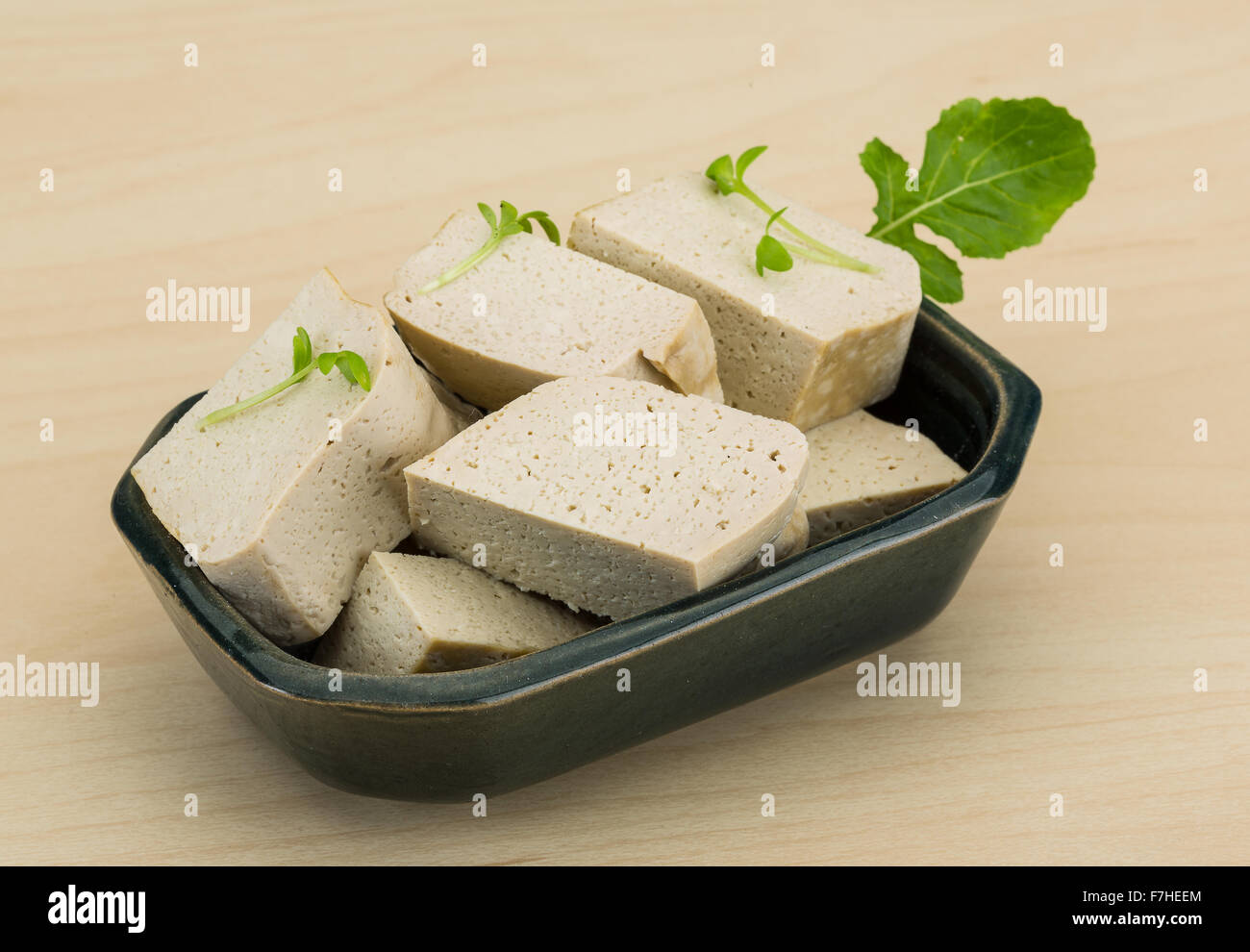 Tofu - soya cheese with herbs on the wood background Stock Photo - Alamy
