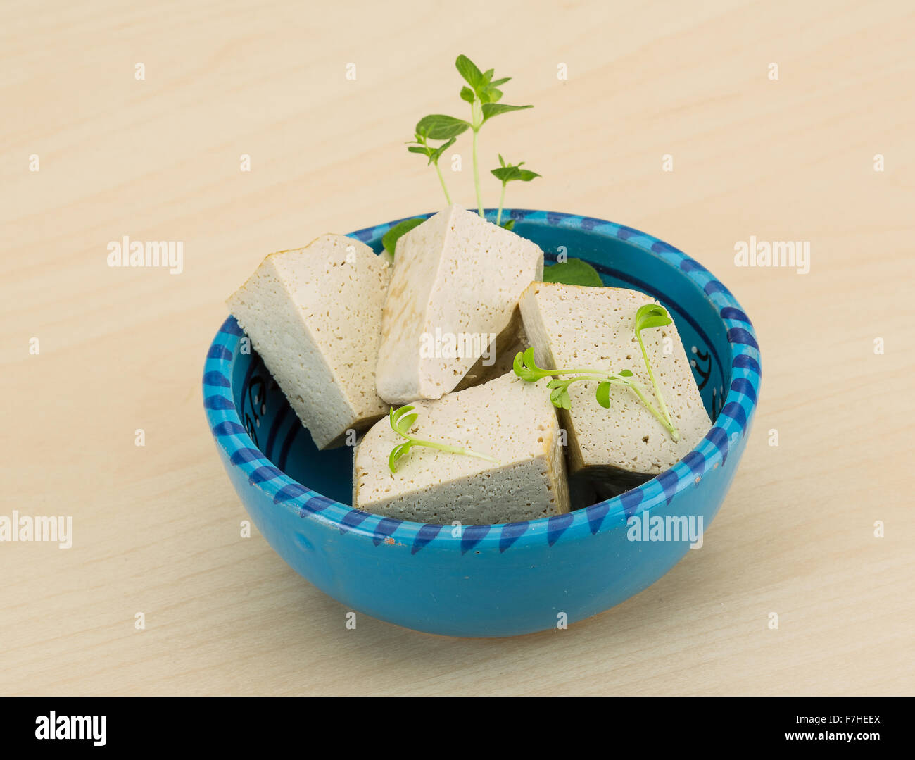 Tofu - soya cheese with herbs on the wood background Stock Photo - Alamy