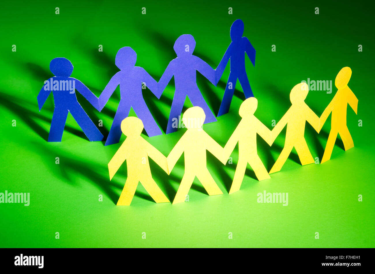 Paper people in teamworking concept Stock Photo - Alamy