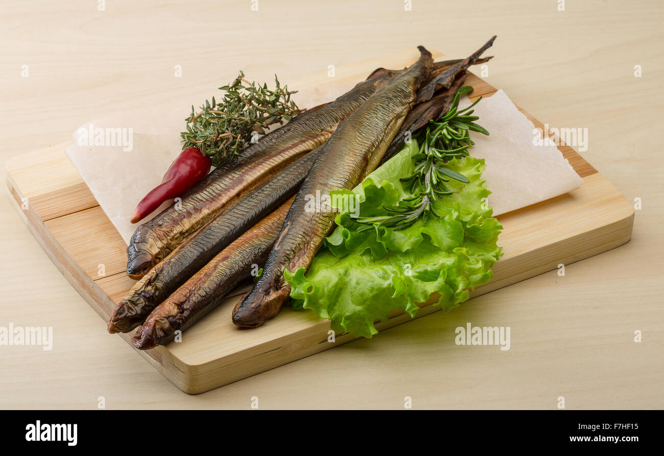 Smoked Lamprey - seafood delicacy with salad and herbs Stock Photo - Alamy