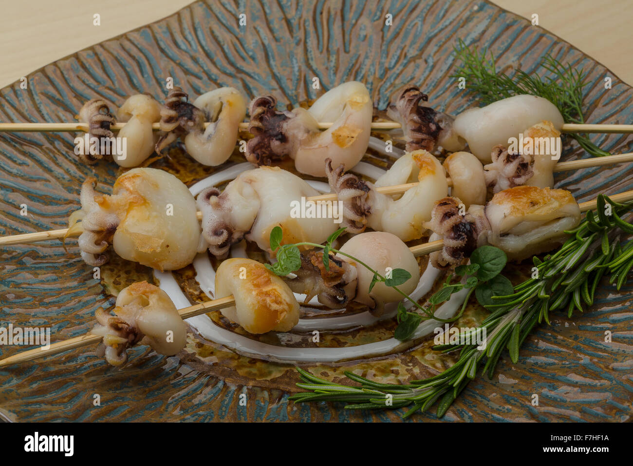 Grilled cuttlefish bbq with rosemary and pepper Stock Photo - Alamy