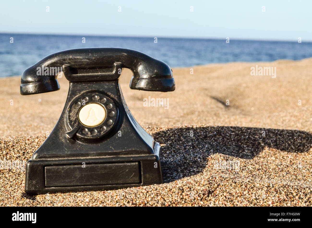 Phone on the Sand Beach Stock Photo - Alamy