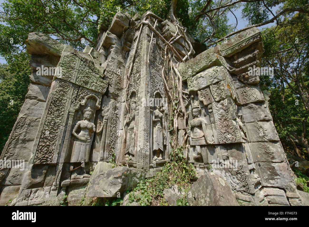 Statues and carvings at the jungle temple of Beng Mealea, Siem Reap ...