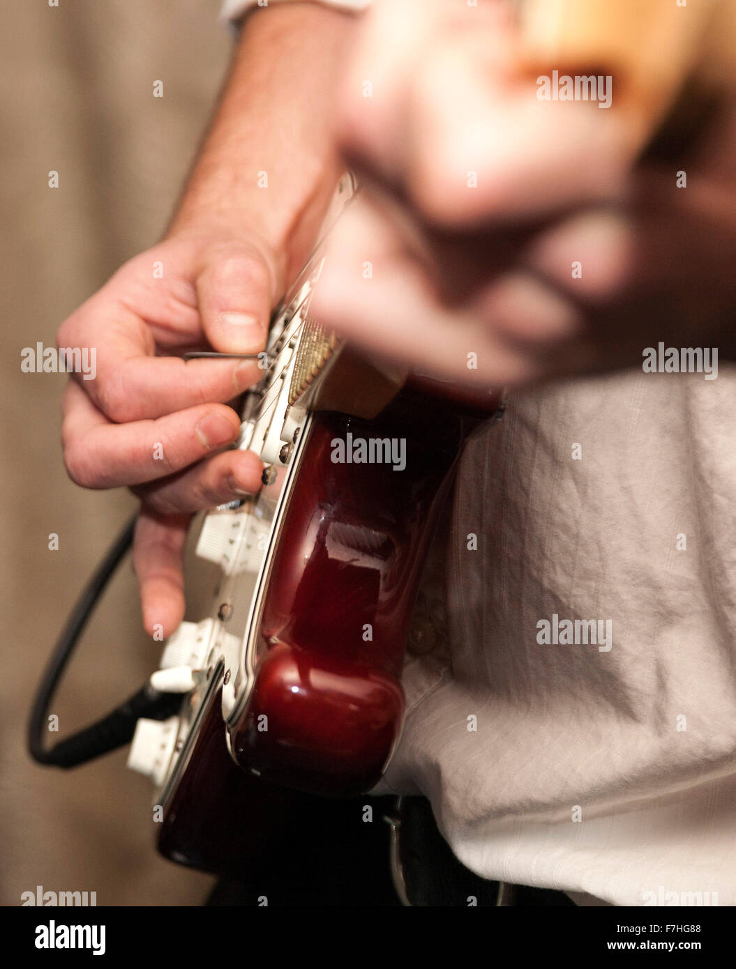 Electric guitar being played at a gig Stock Photo - Alamy