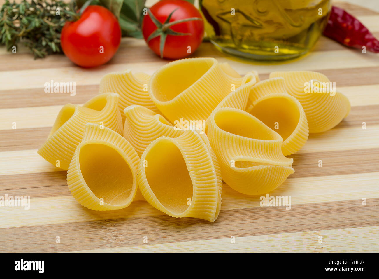 Pipe rigate pasta on the wood background Stock Photo - Alamy