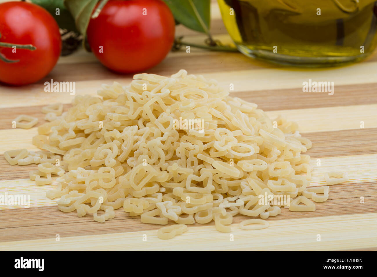 Raw ABC macaroni on the wood background Stock Photo - Alamy