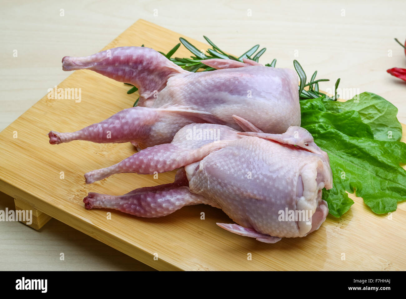 Raw quail with herbs ready for cooking Stock Photo - Alamy