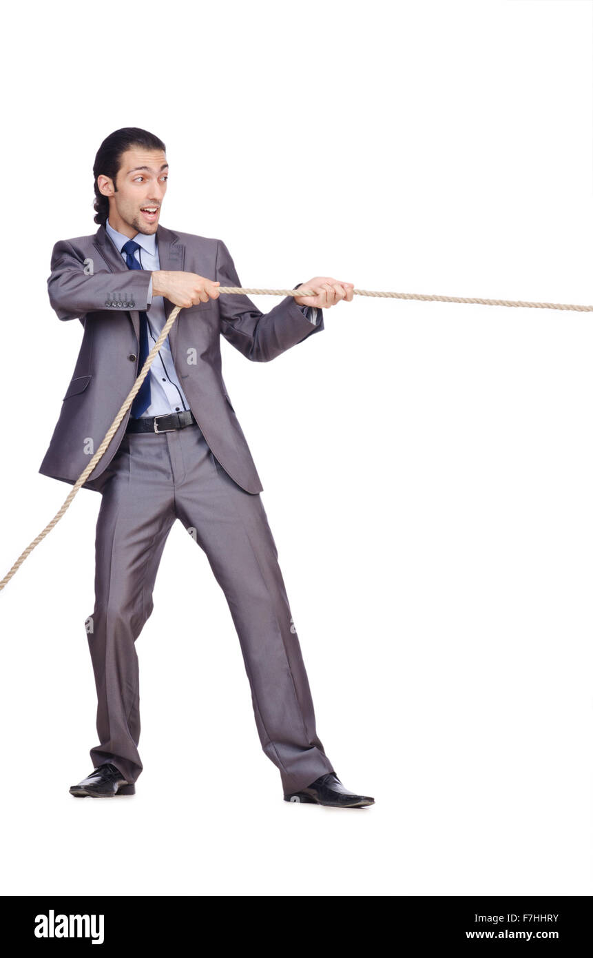 Businessman pulling rope on white Stock Photo - Alamy