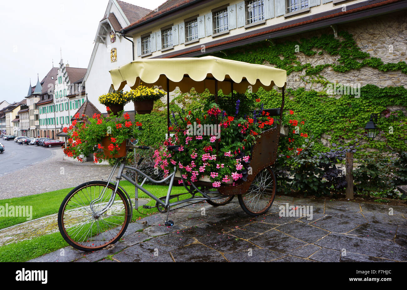 Rikshka filled with flowers, Town Bulle, Fribourg, Switzerland Stock ...
