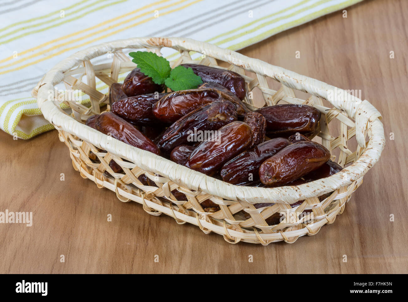 Dry Dates fruit in the bowl on the wood background Stock Photo - Alamy