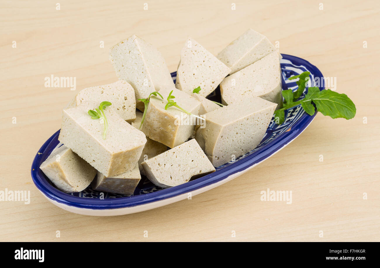 Tofu - soya cheese with herbs on the wood background Stock Photo - Alamy