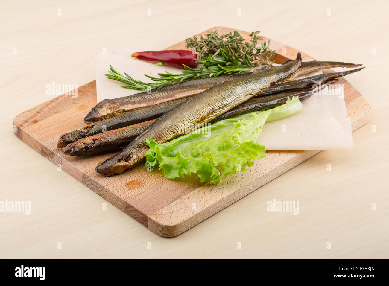 Smoked Lamprey - seafood delicacy with salad and herbs Stock Photo - Alamy