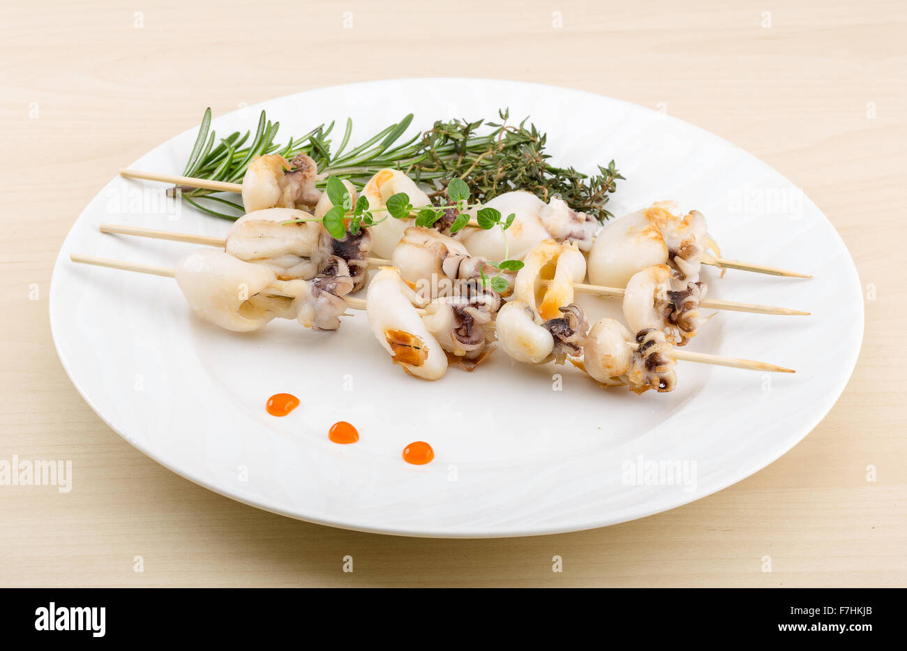 Grilled cuttlefish bbq with rosemary and pepper Stock Photo - Alamy