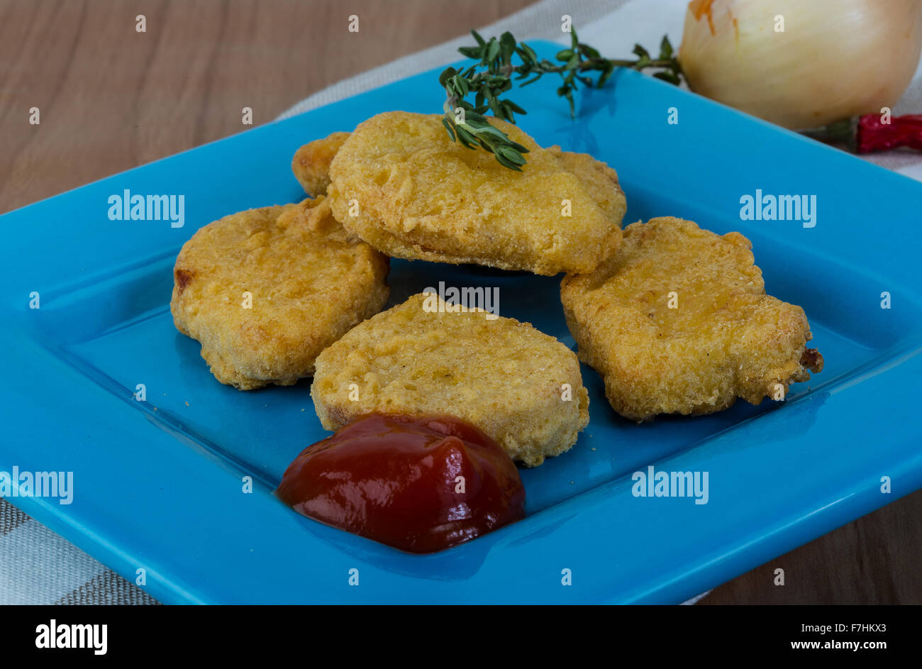 Chicken Nuggets in the blue plate with sauce Stock Photo - Alamy