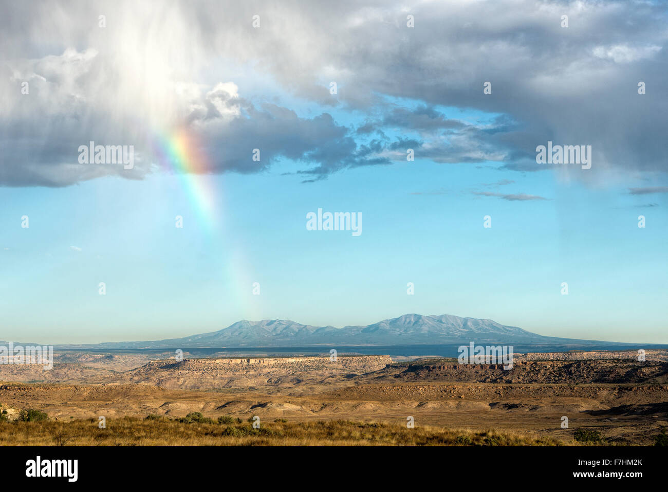 Rainbow over Cross Canyon with the Abajo Mountains in the background ...