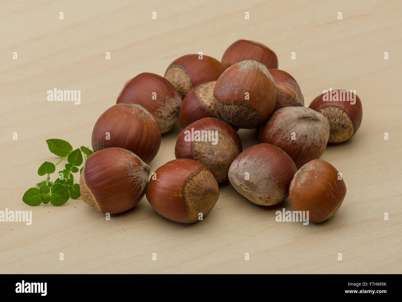 Fresh Hezelnut heap on the wood background Stock Photo - Alamy