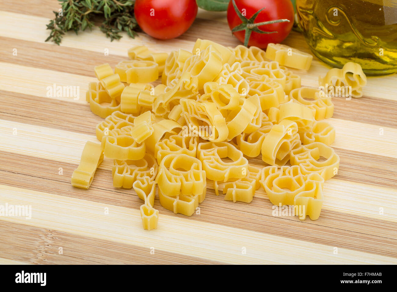 Raw Italian Pasta animal on the wood background Stock Photo - Alamy