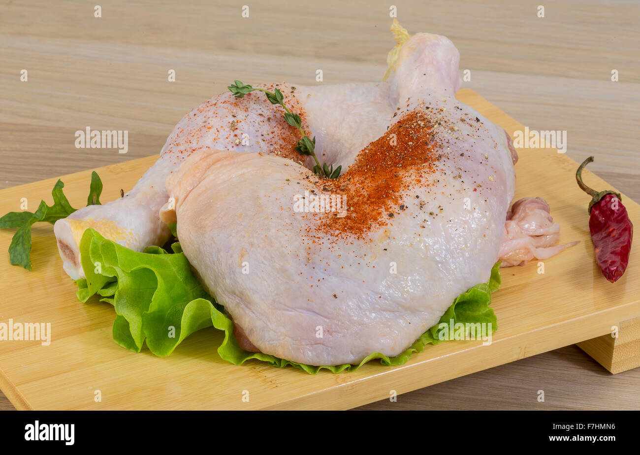 Raw chicken leg with herbs ready for cooking Stock Photo - Alamy