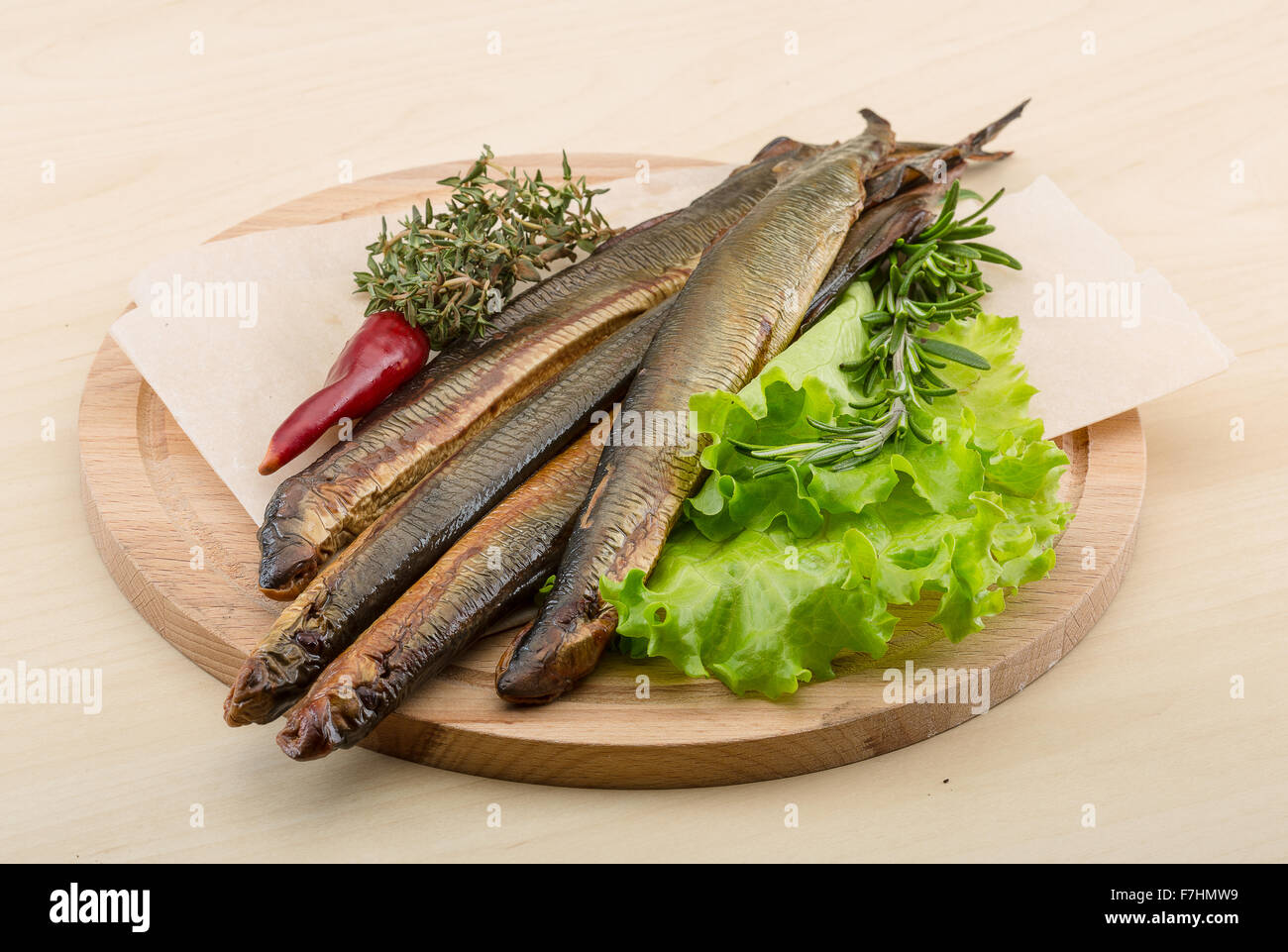 Smoked Lamprey - seafood delicacy with salad and herbs Stock Photo - Alamy