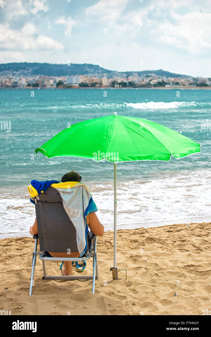 Man beach relax under parasol hi-res stock photography and images - Alamy