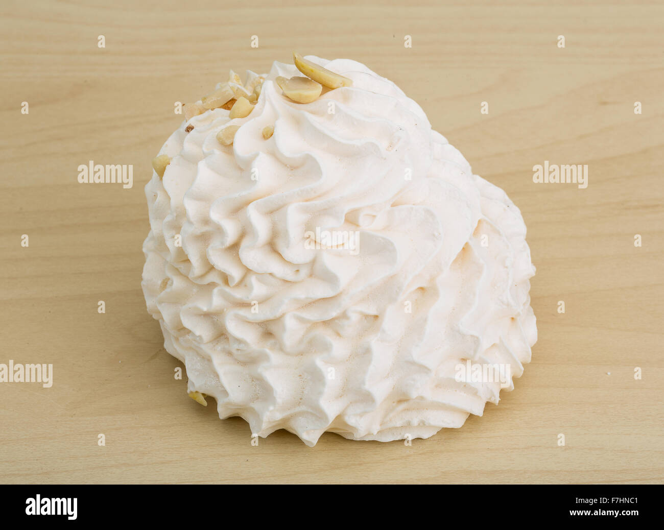 White meringue with nut on the wood background Stock Photo - Alamy