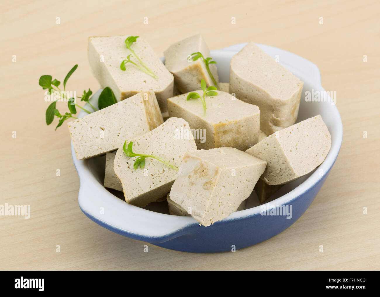 Tofu - soya cheese with herbs on the wood background Stock Photo - Alamy