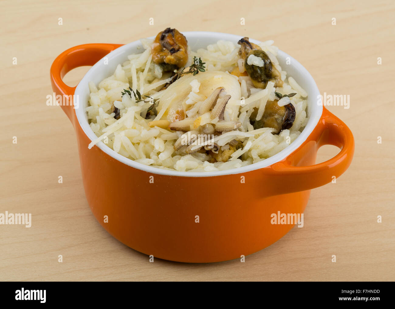 Risotto with mussels and cuttlefish served fresh thyme Stock Photo - Alamy